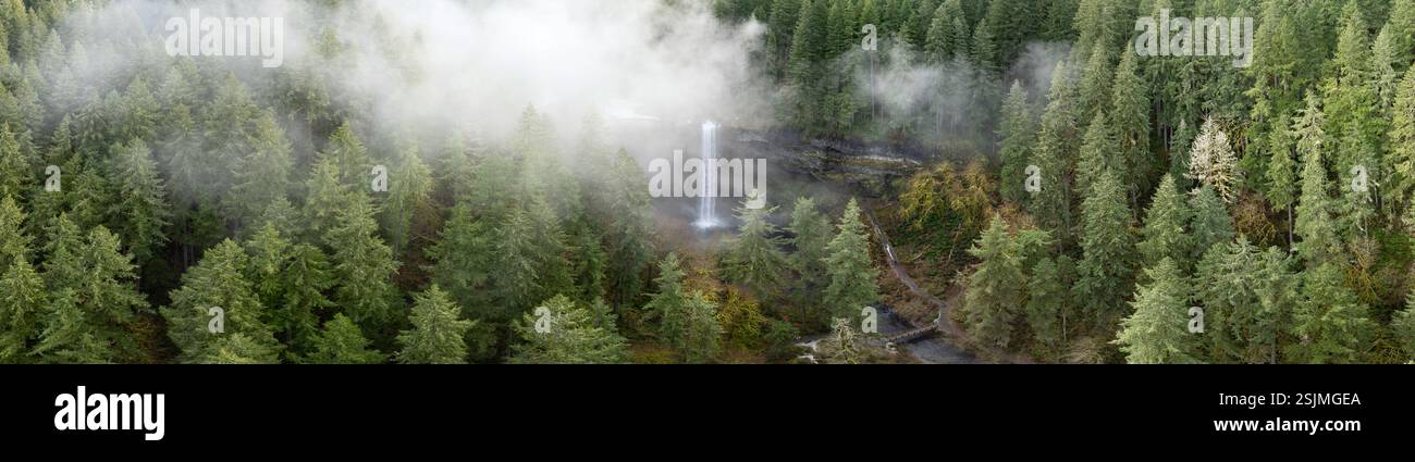 Wispy clouds drifts above the magnificent South Falls in Oregon. The ...