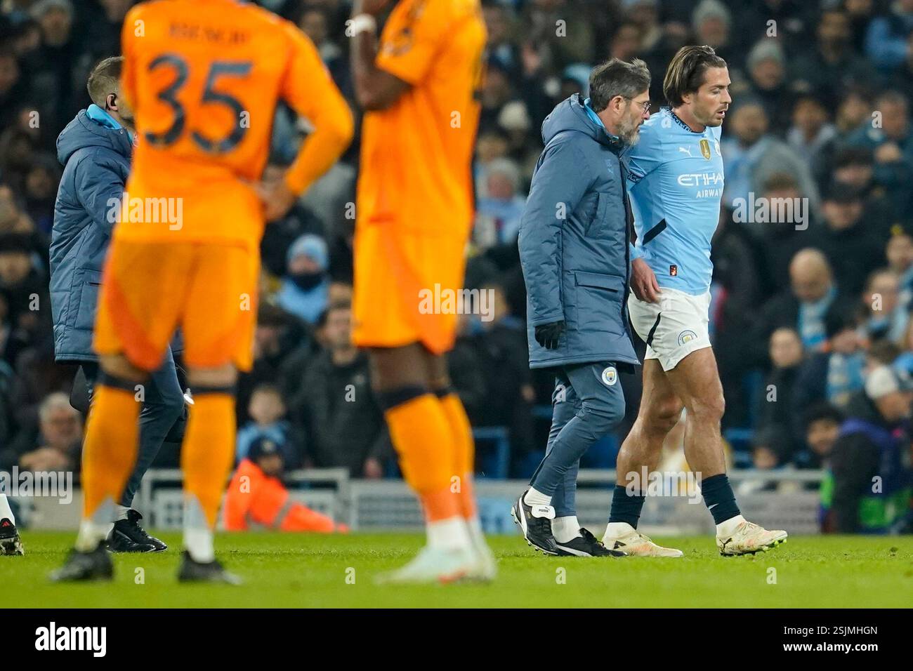 Manchester City's Jack Grealish walks off the pitch after suffering an ...