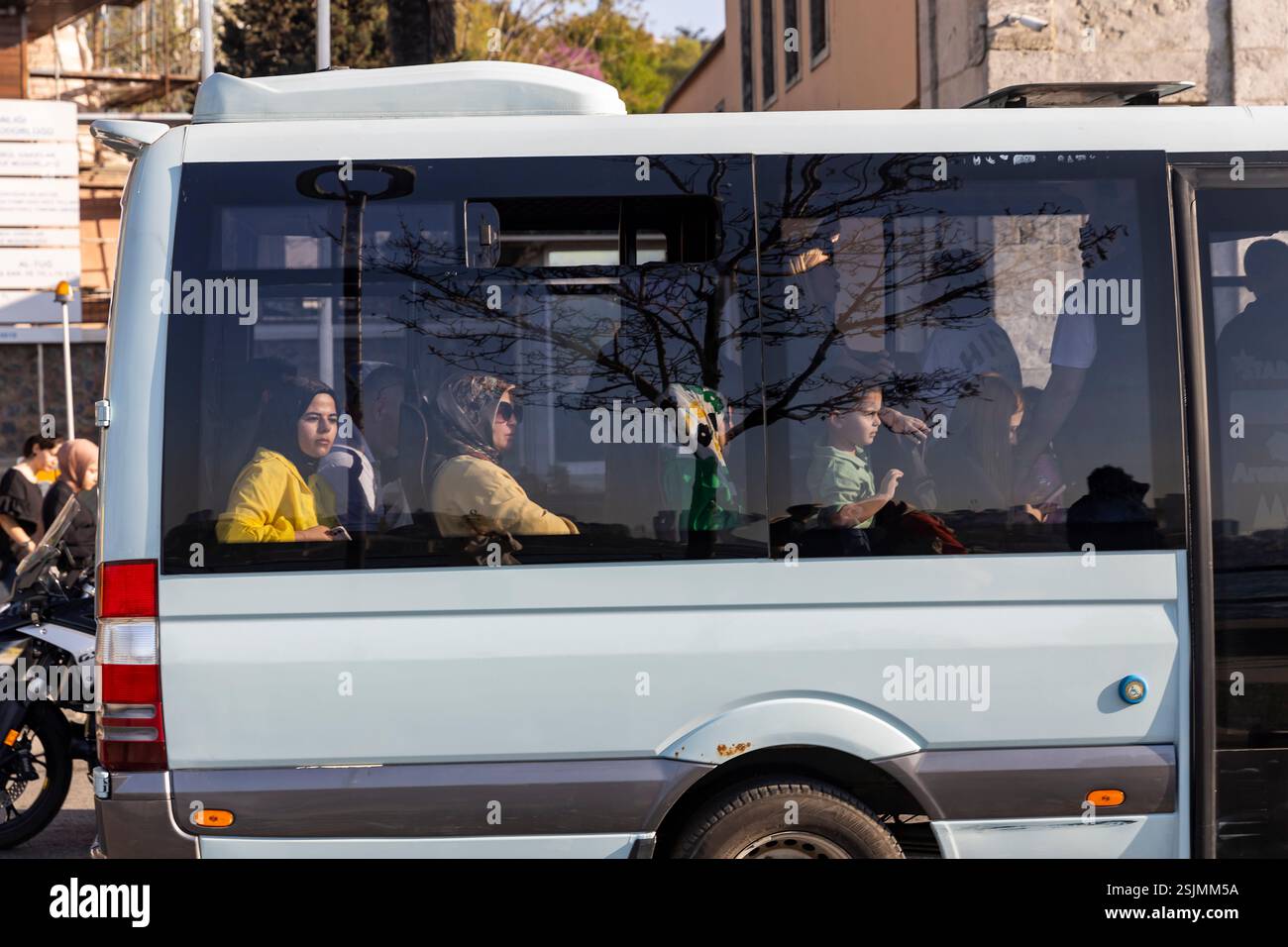 Istanbul, Turkey – May 2, 2024, brightly dressed girls in hijabs riding ...