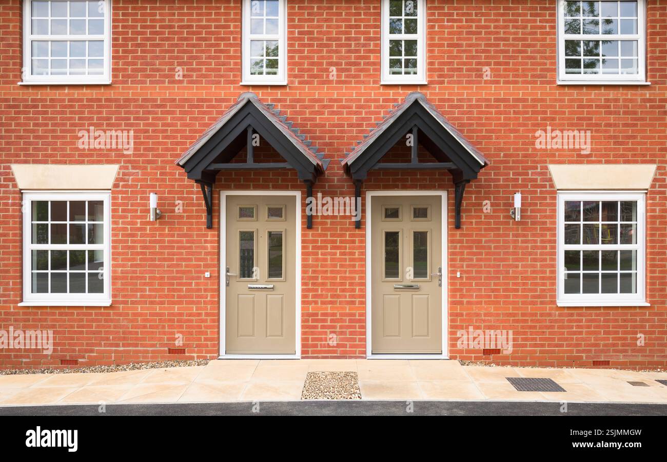 Front door of new build homes for sale on a new housing development, UK Stock Photo - Alamy