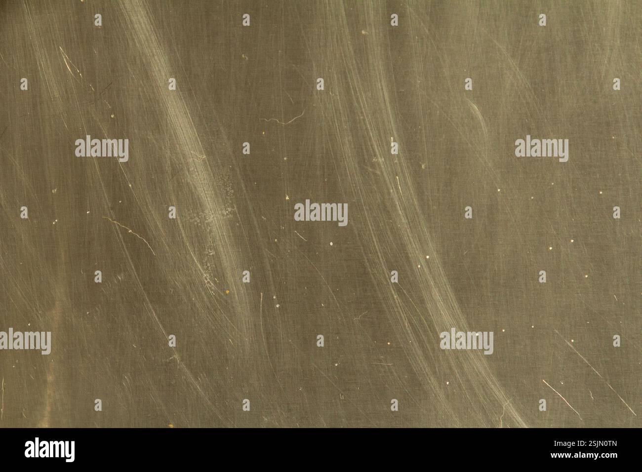 Close-up of a scratched and worn metal surface with visible scratches ...