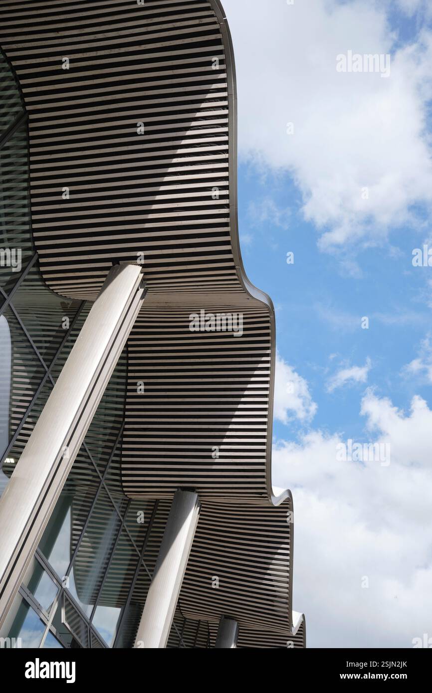 Detailed view of the free-form corrugated roof of the sports stadium ...