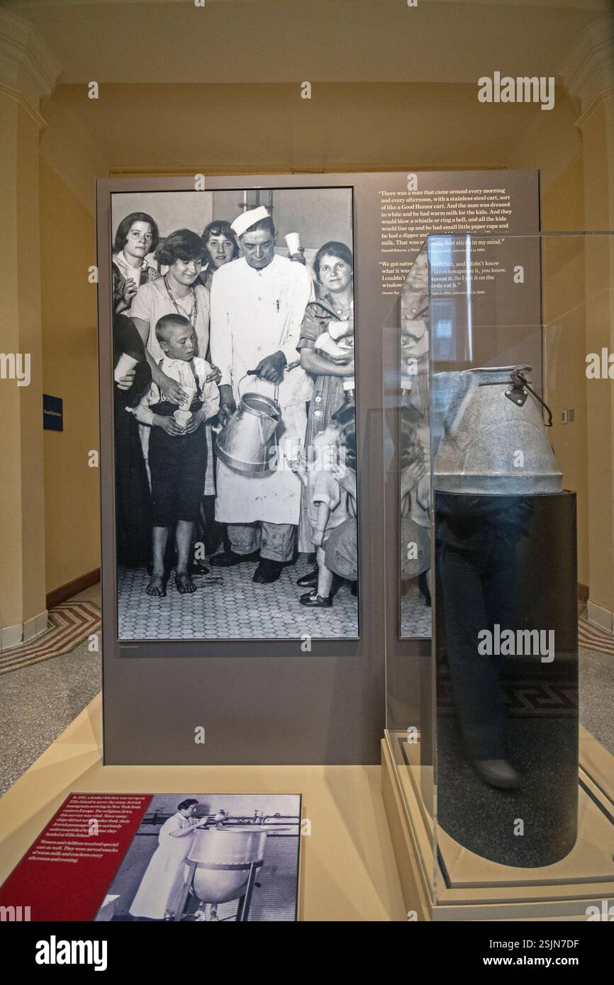 Photograph showing the distribution of milk to kids and women ...