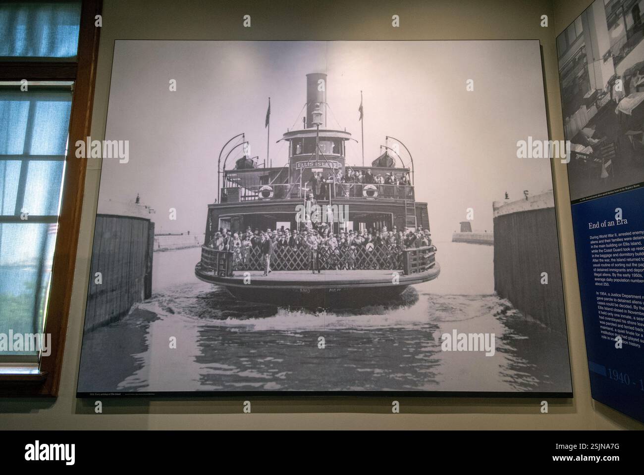 Old photograph of ferry-boat with immigrants in Ellis Island National ...