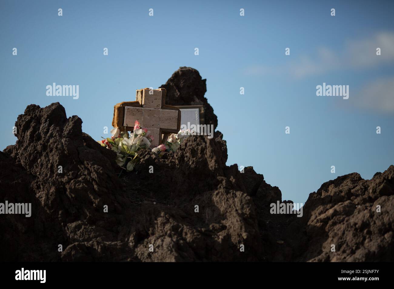 A cross on the rock as a symbol of a misfortune Stock Photo - Alamy