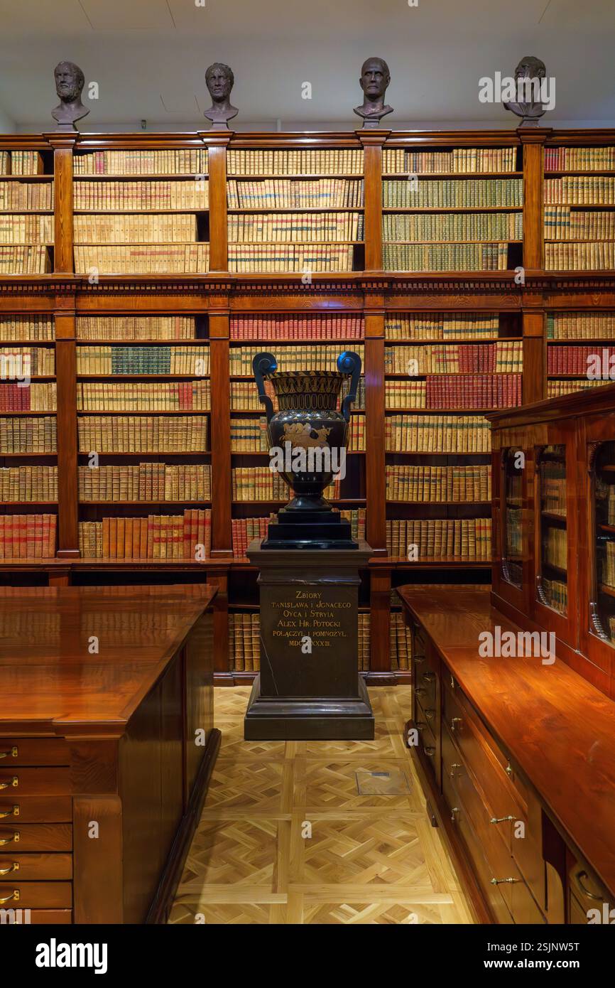 Interior of a historic renovated library with shelves of old books and ...
