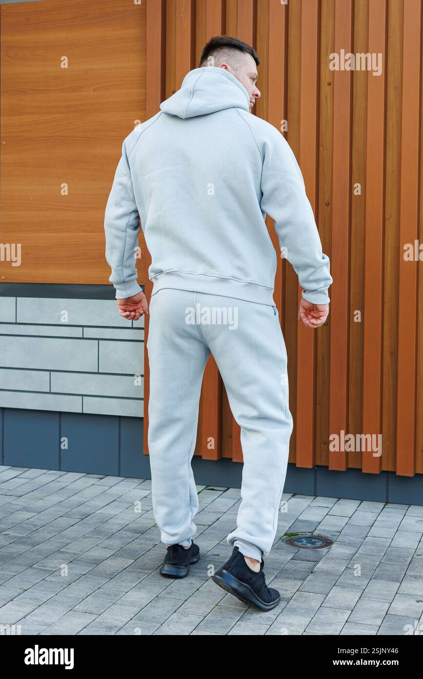 Man in a gray tracksuit. Men's fleece suit for cold walks. Men's ...
