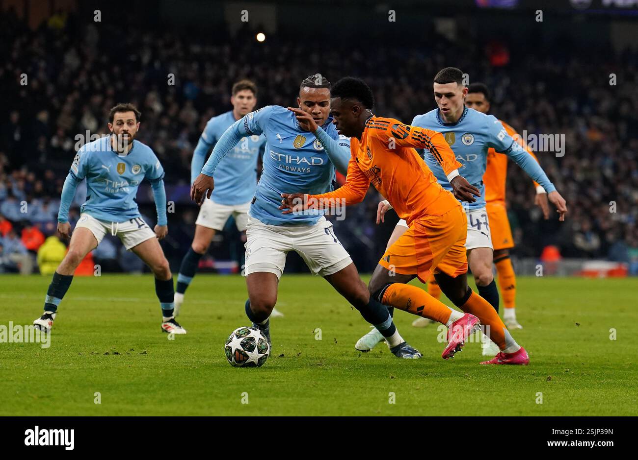 Real Madrid's Vinicius Junior up against Manchester City's Manuel ...