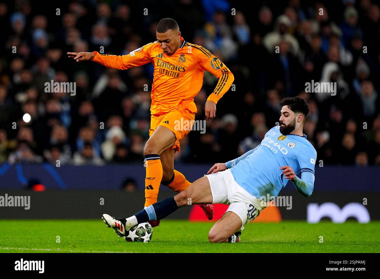 Real Madrid's Kylian Mbappe is tackled by Manchester City's Josko Gvardiol during the UEFA ...