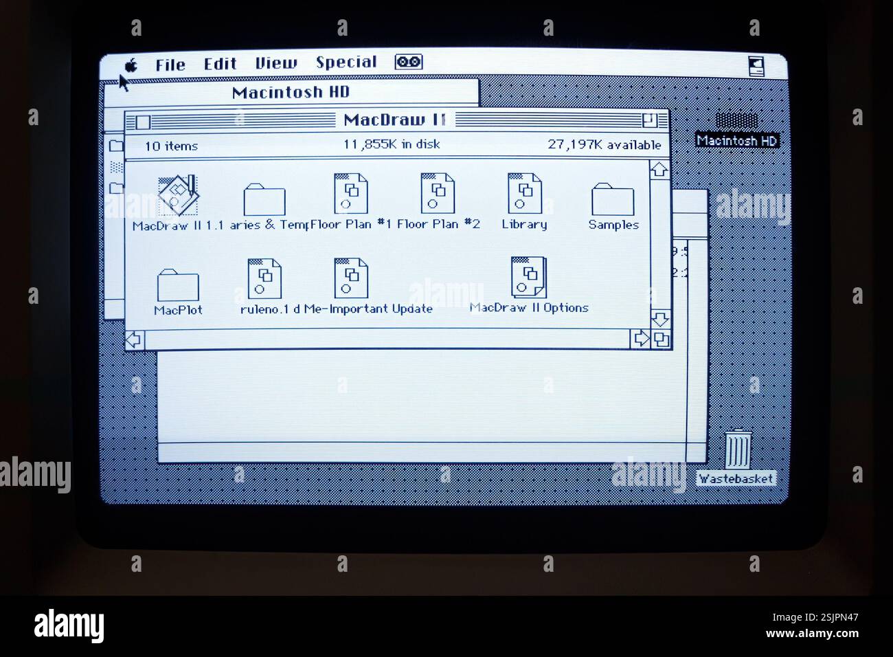 Vintage Macintosh computer screen displaying Mac Draw II software folder window and menubar in ...