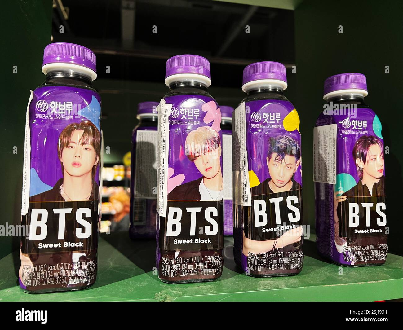 Kyiv, Ukraine - February 11, 2025: Purple themed BTS soft drink bottles ...