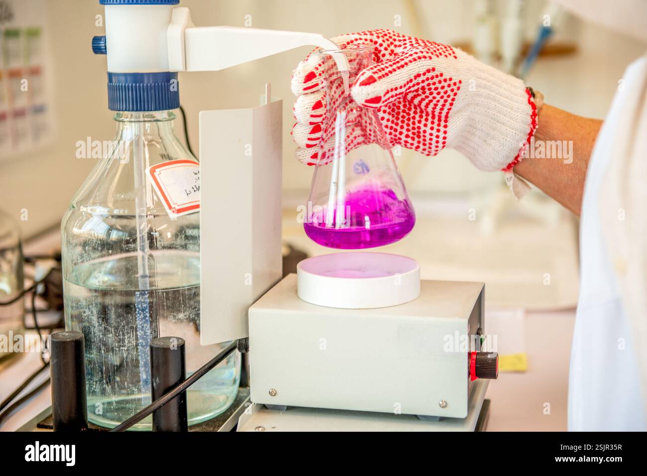 Manual titration station with brown bottle. Laboratory equipment ...