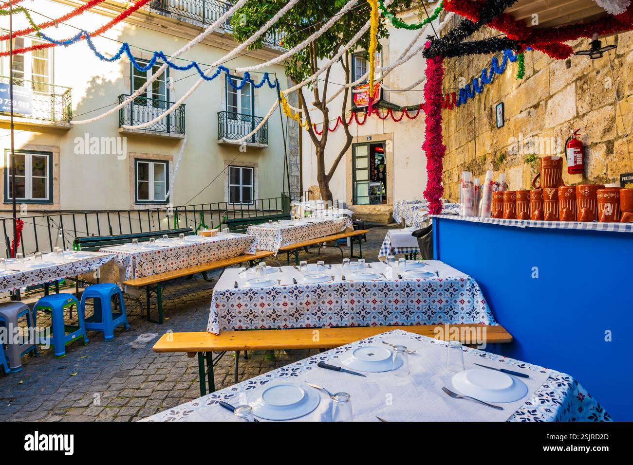 LISBON, PORTUGAL - JUN 11, 2024: Tables of restaurant in Alfama ...