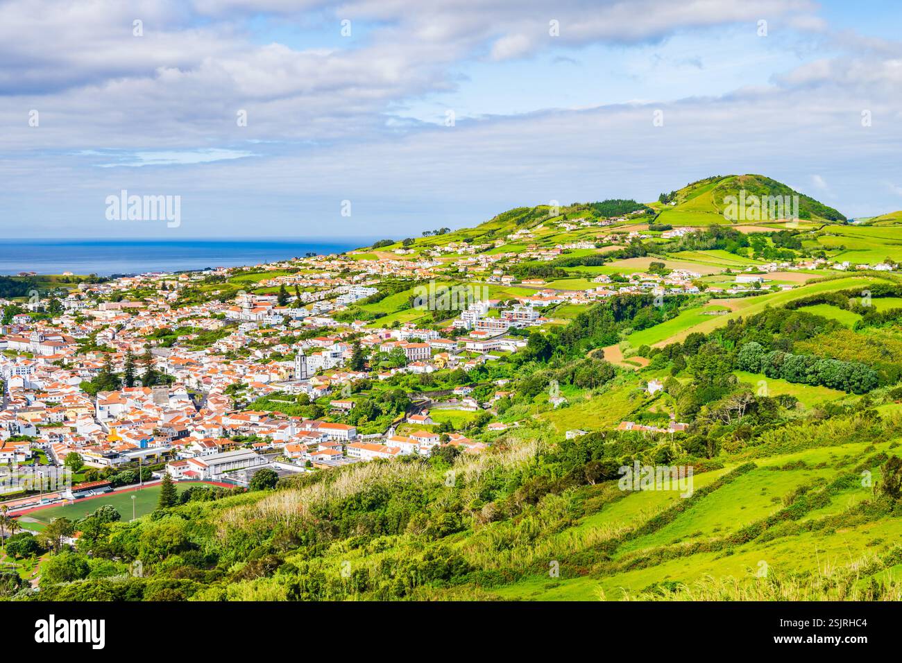View of Horta town and green hills on coast of Faial island, Azores ...