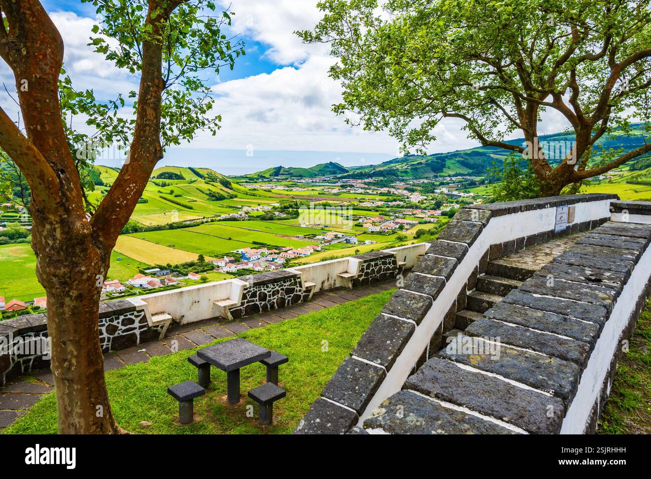 Picnic area and viewpoint over green meadows and hills in rural farming ...