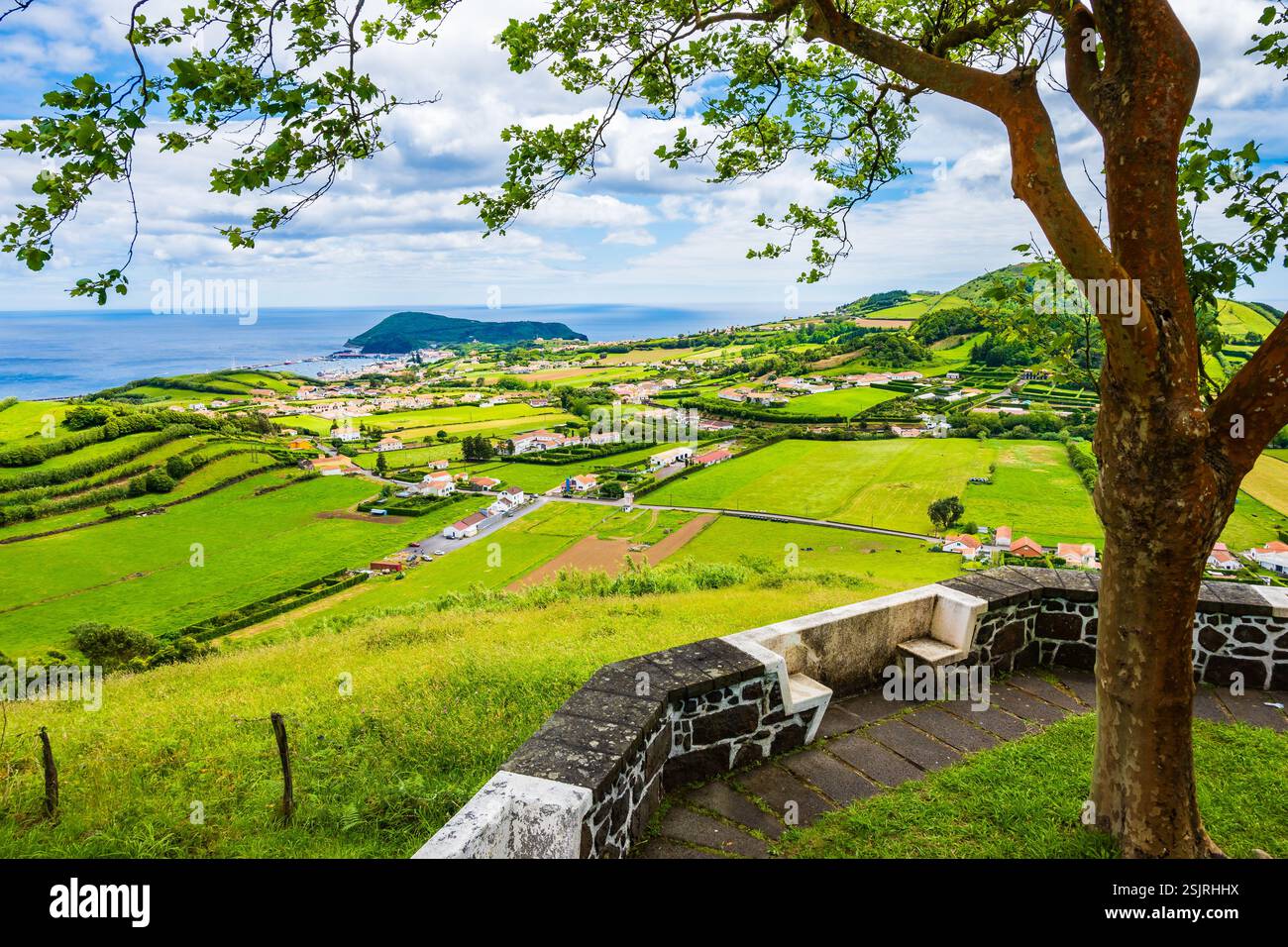 Picnic area and viewpoint over green meadows and hills in rural farming ...