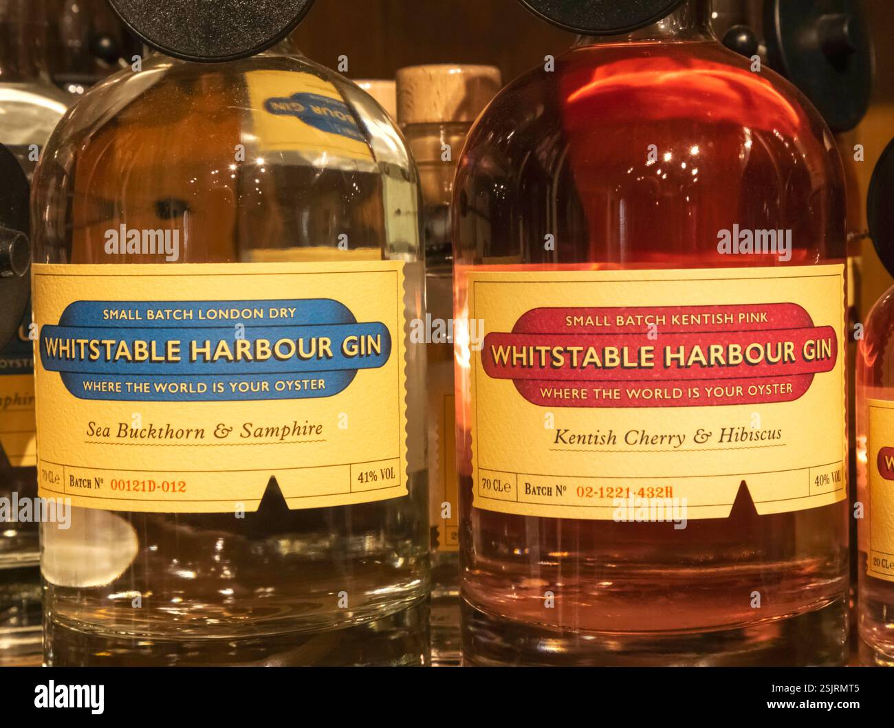 Colourful display of whitstable harbour bottled gin hi-res stock ...