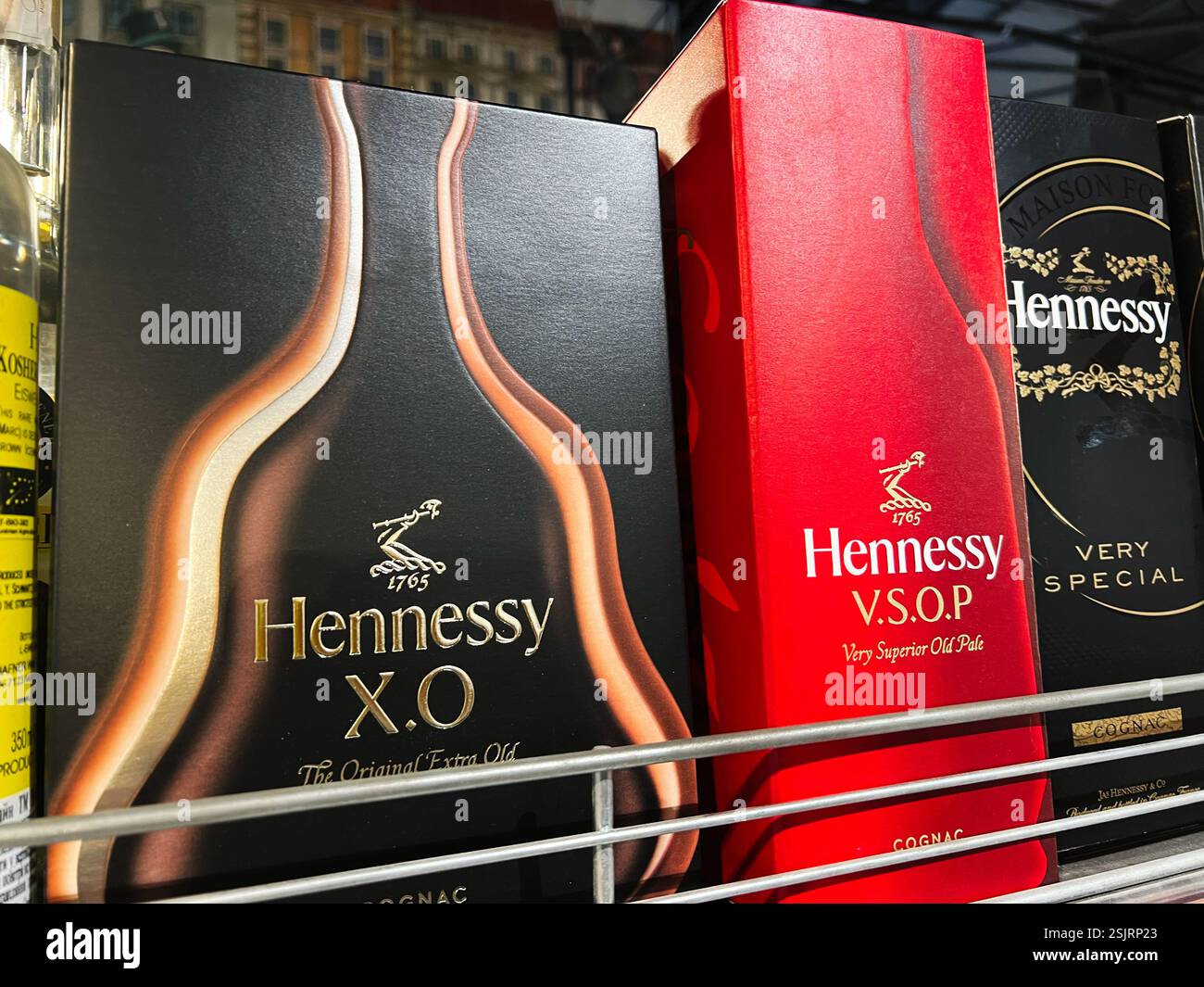 Kyiv, Ukraine - February 11, 2025: Multiple Hennessy cognac boxes with ...