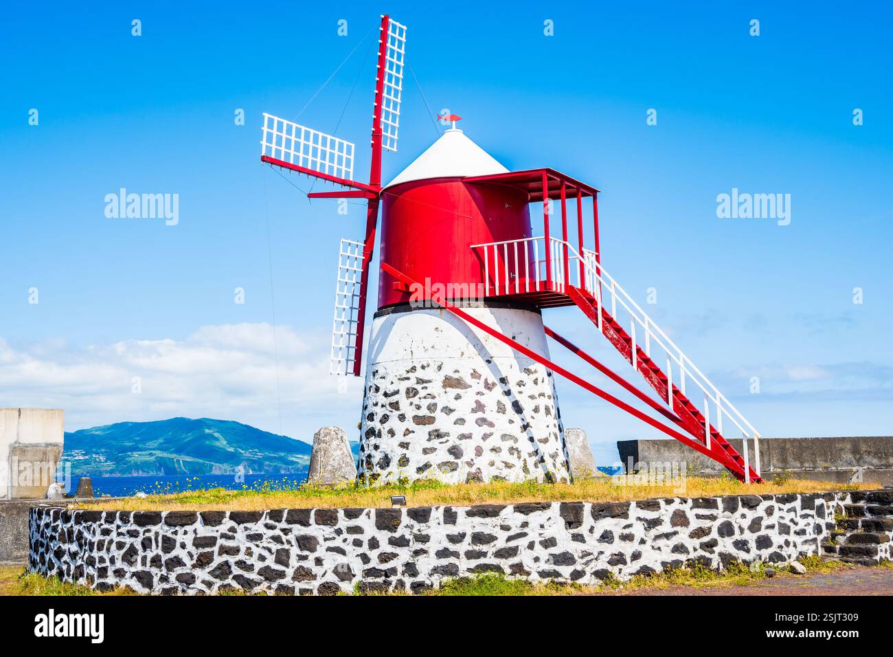 Historic windmill building among vineyard and volcanic rocks, Pico ...