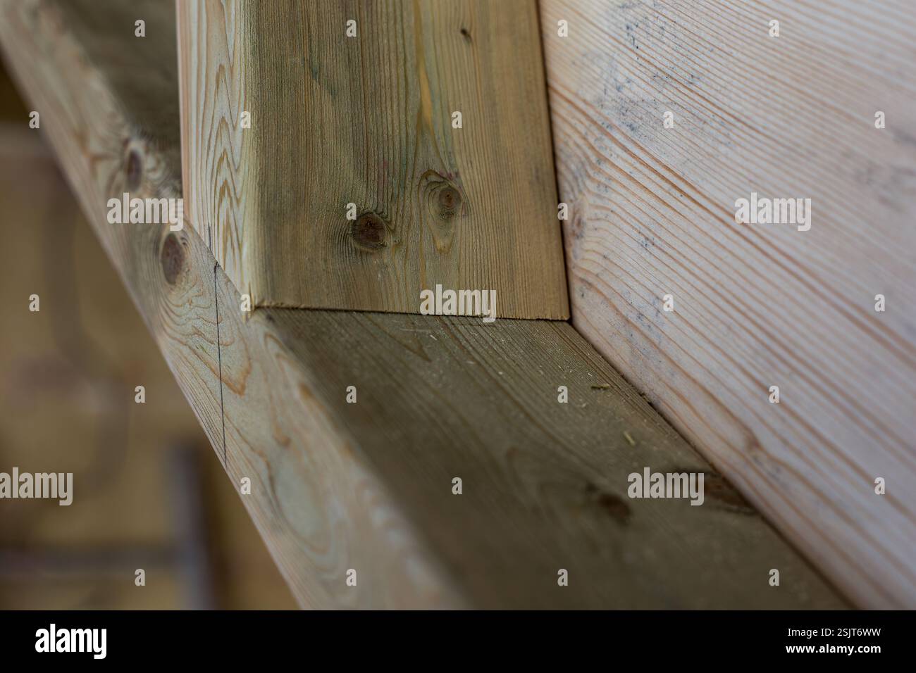 Close-up view of wooden beams joined together at a angle showcasing ...