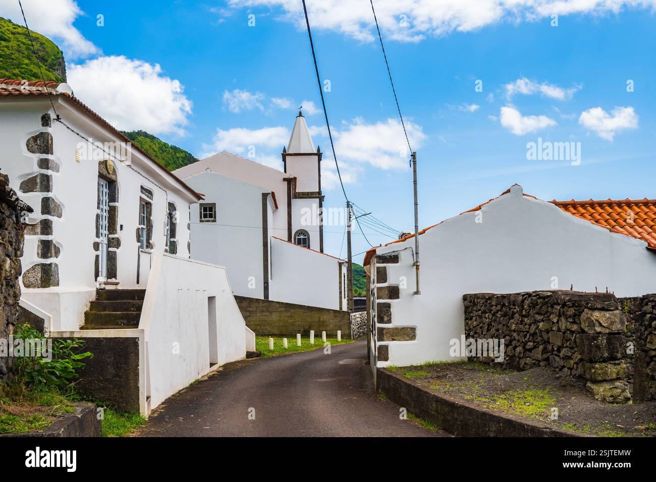 Church and typical houses in traditional style architecture in Faja ...