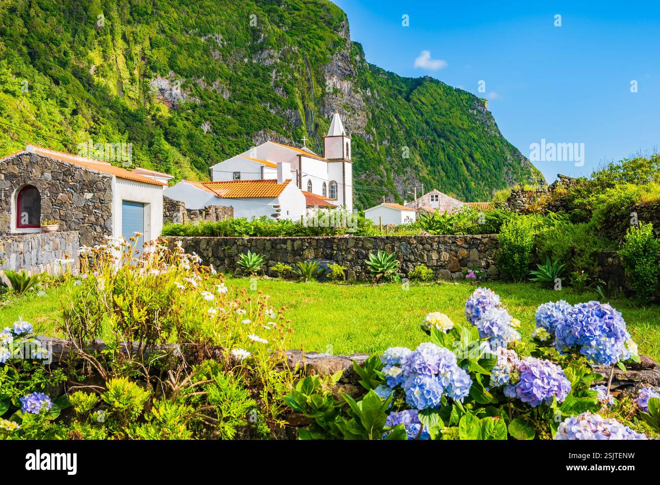 Church and typical houses in traditional style architecture in Faja ...