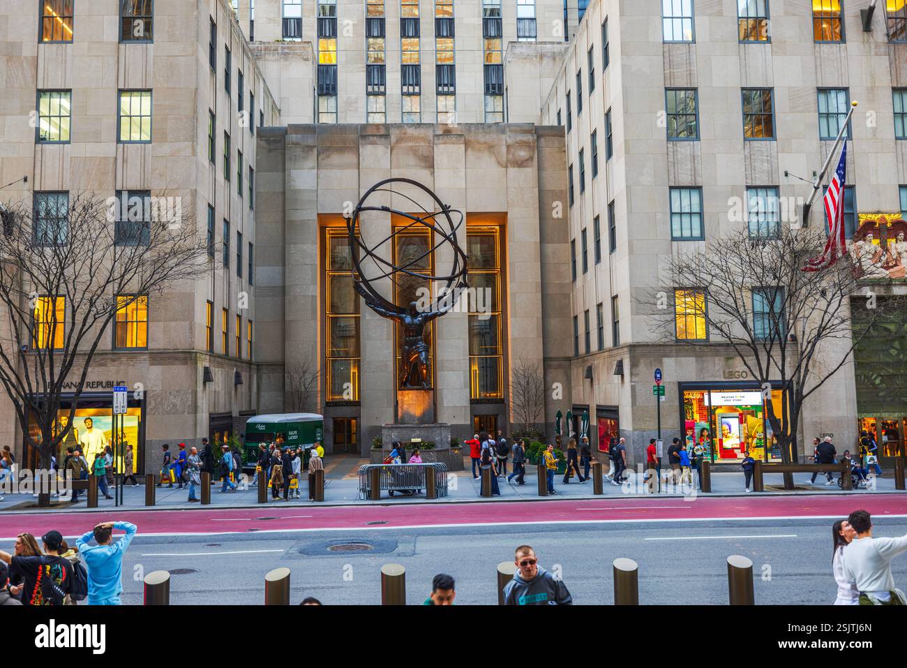Atlas statue at Rockefeller Center in New York City with pedestrians ...