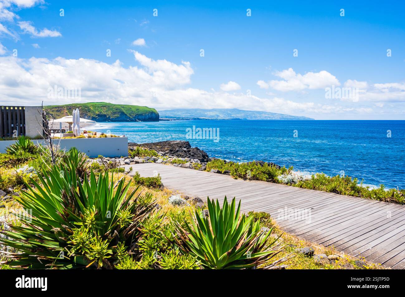 Wooden path along ocean coast to Santa Barbara beach, Sao Miguel island ...