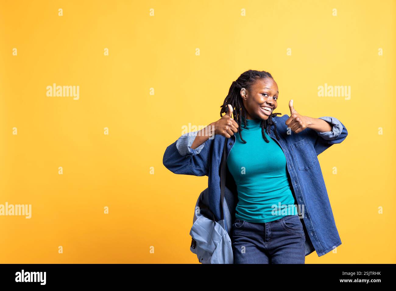 Woman doing thumbs up hand gesturing, showing approval, having positive ...