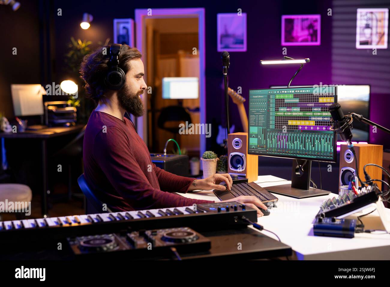 Musical producer working on editing audio recordings with daw software ...