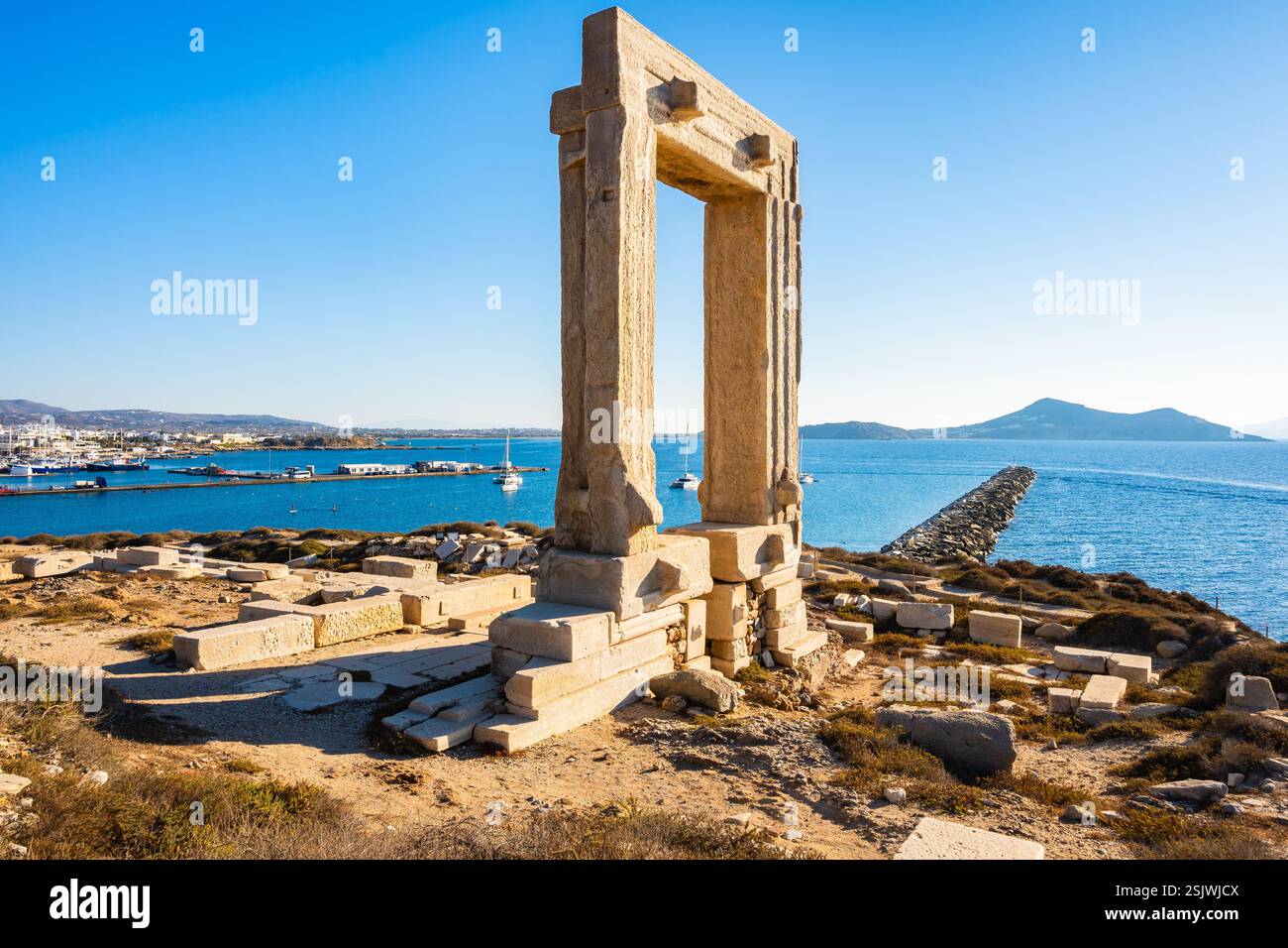 Portara monument also known as Temple of Apollo overlooking port and ...