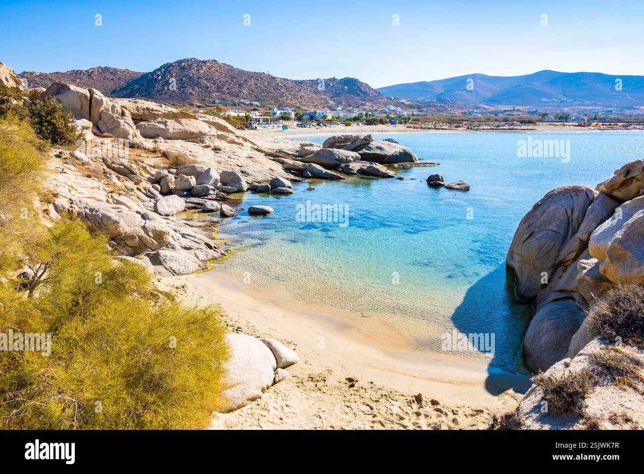 Beautiful sandy beach of Mikri Vigla with rocks in azure sea water ...
