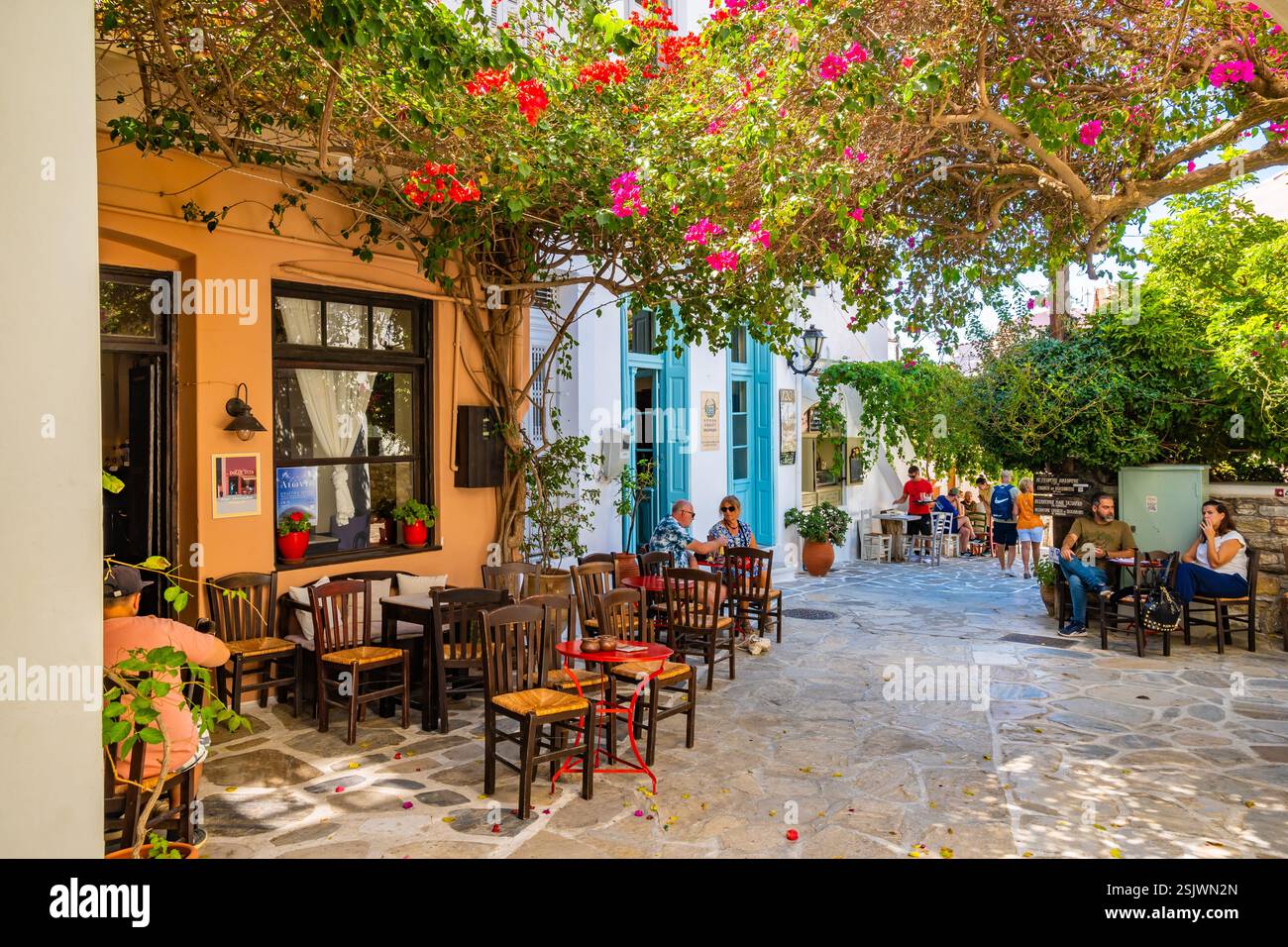 FILOTI VILLAGE, NAXOS ISLAND: SEP 26, 2024: People dining in typical ...