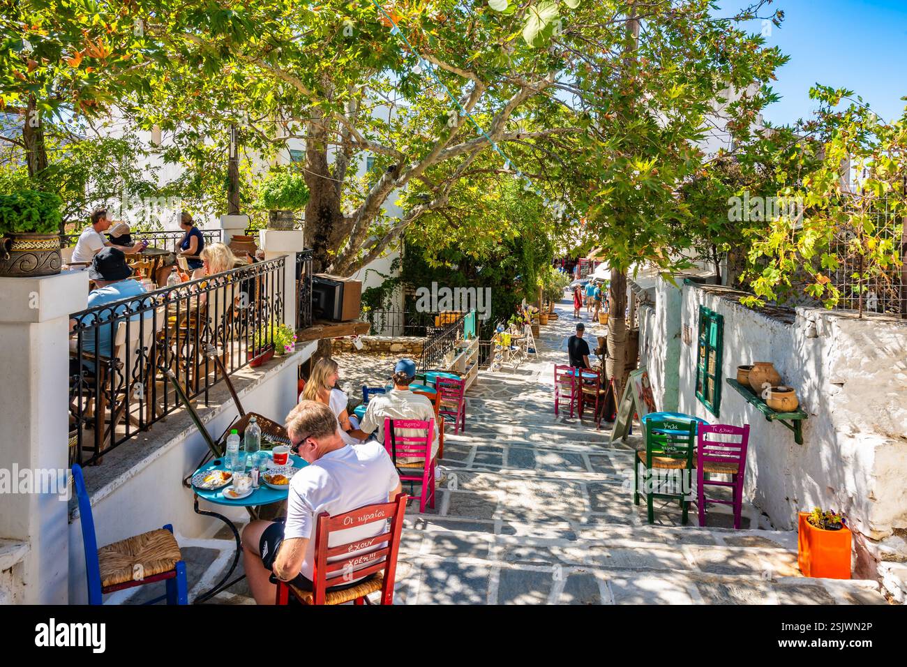 FILOTI VILLAGE, NAXOS ISLAND: SEP 26, 2024: People dining in typical ...