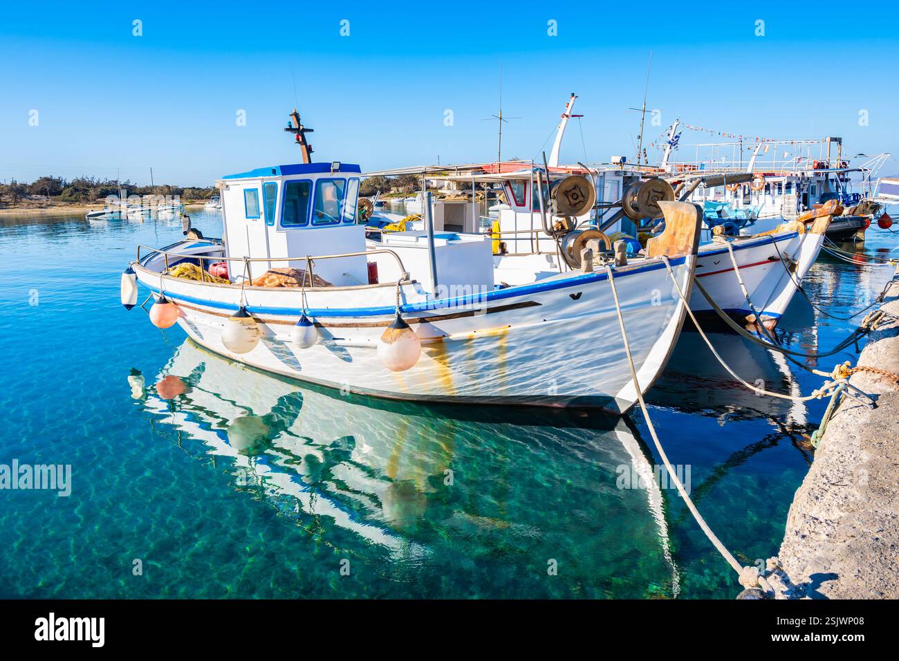 Fishing boats anchoring in small port of Agia Anna, Naxos island ...