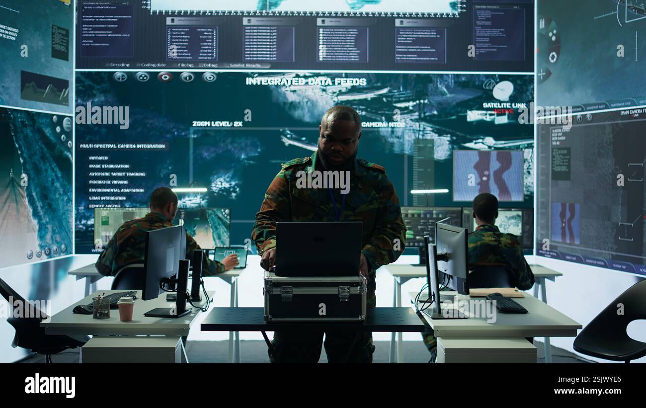 Military expert in a control center uses advanced technology and gear ...