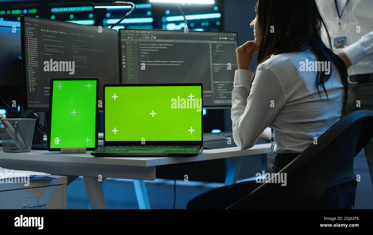 Engineers In Data Center Monitoring Security Threats Using Chroma Key