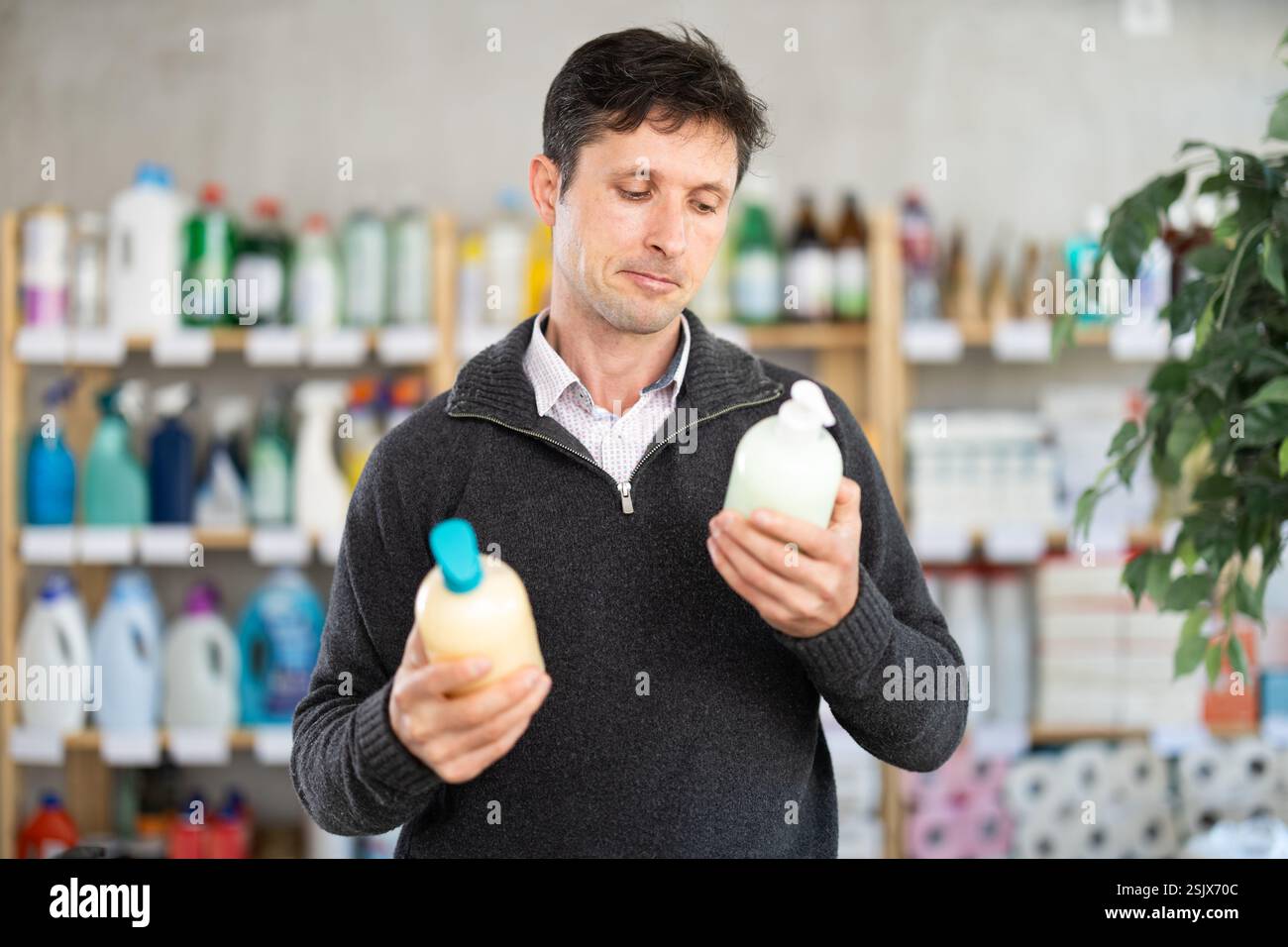 Middle-aged man choosing liquid hand soap at department store Stock ...