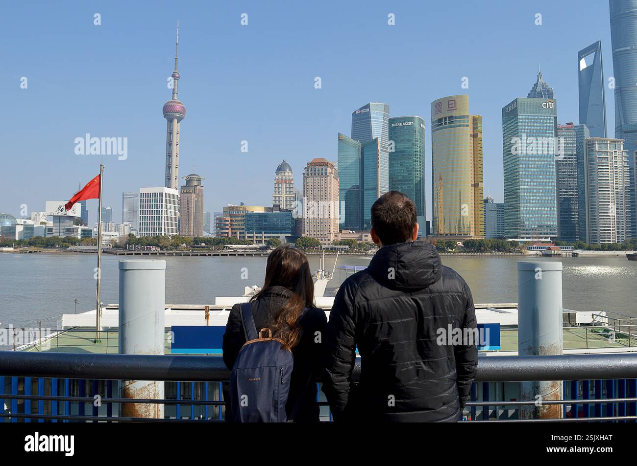 SHANGHAI, CHINA - 4 JANUARY 2025: Two tourists admire the skyline of ...