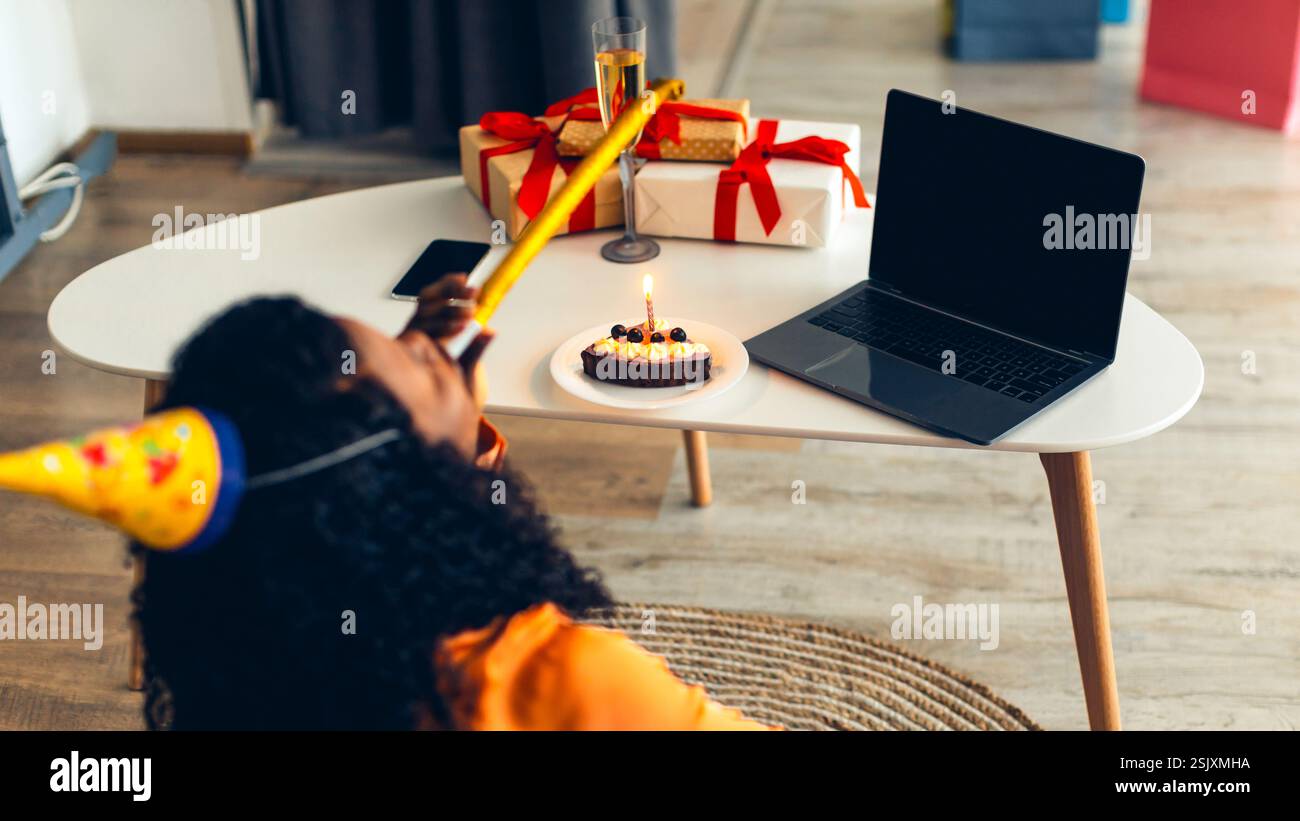 African Lady At Laptop Blowing Party Horn Celebrating Birthday Indoor ...