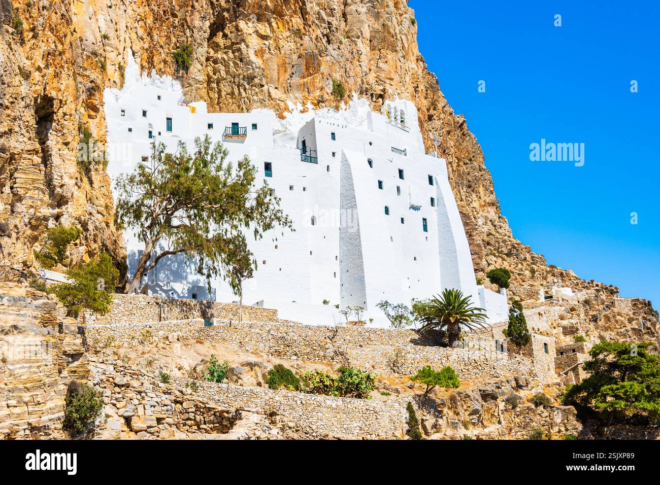 Famous white building of Panagia Hozoviotissa monastery hanging on the ...