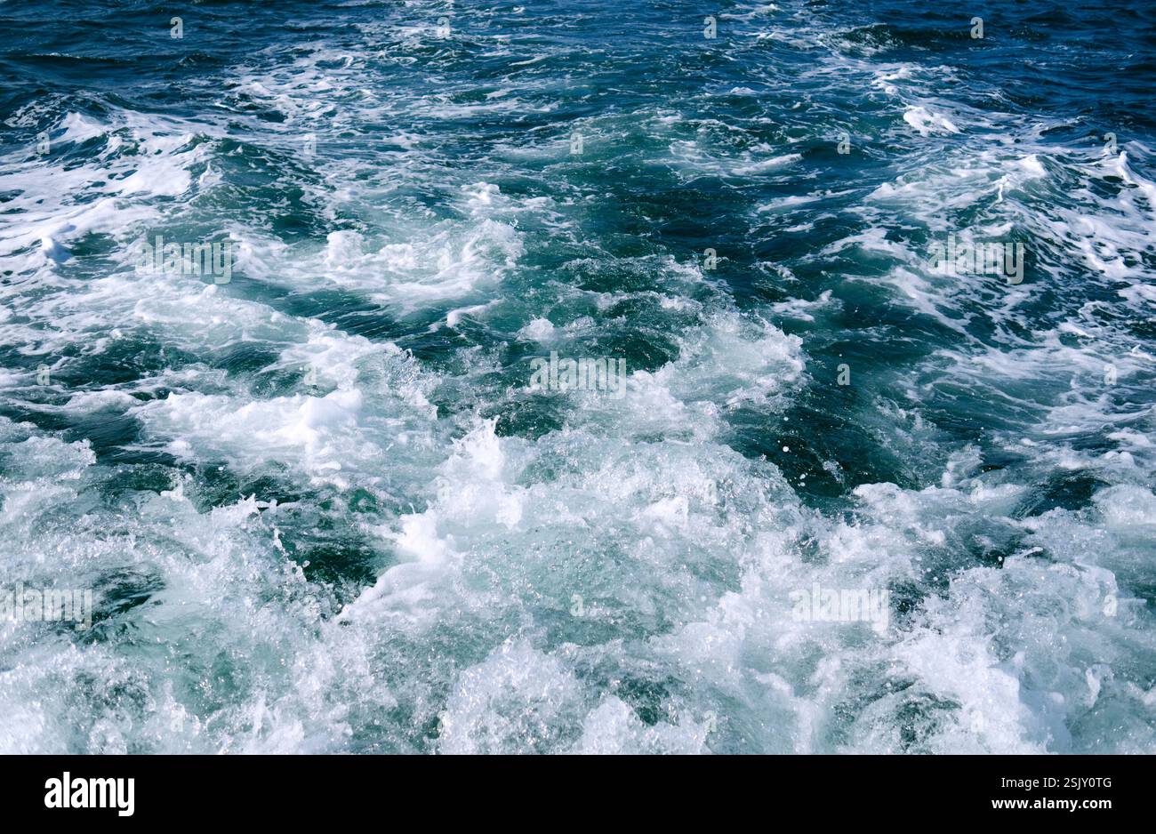 Baltic Sea, Denmark: Stern wave of a small excursion and fishing boat ...