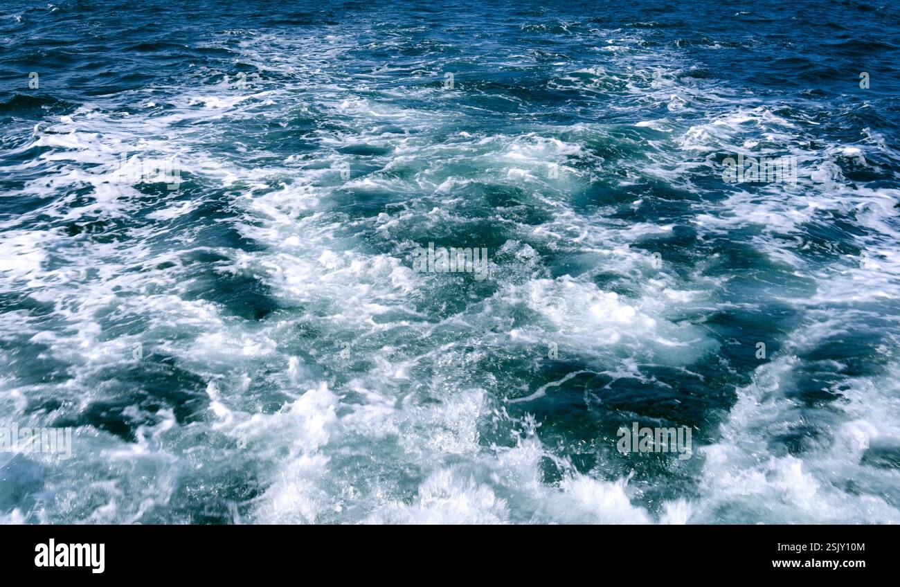 Baltic Sea, Denmark: Stern wave of a small excursion and fishing boat ...