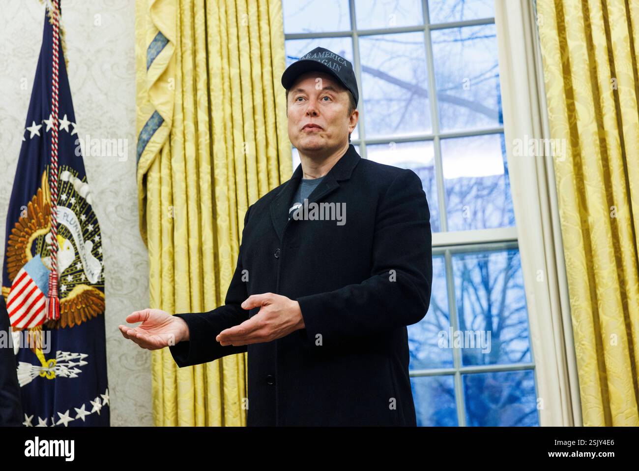 Elon Musk gives remarks to the media in the Oval Office of the White ...