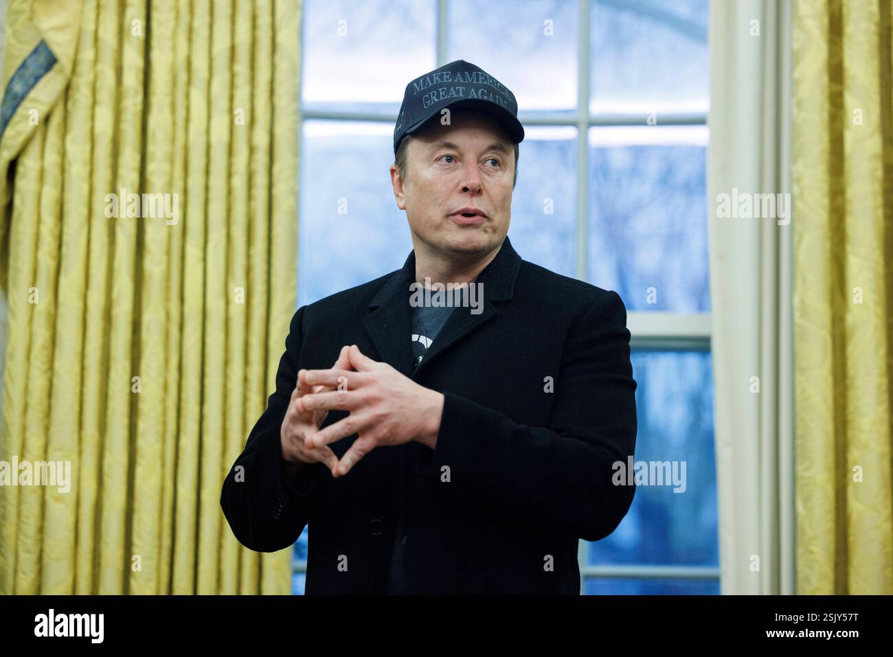 Elon Musk gives remarks to the media in the Oval Office of the White ...