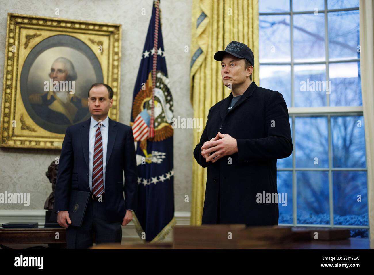 Elon Musk gives remarks to the media in the Oval Office of the White ...