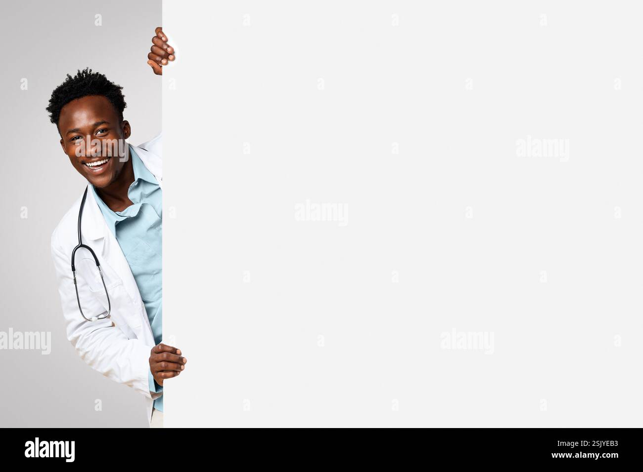 Medical Ad. Black Male Doctor Peeking Out Of Big Blank Advertisement ...