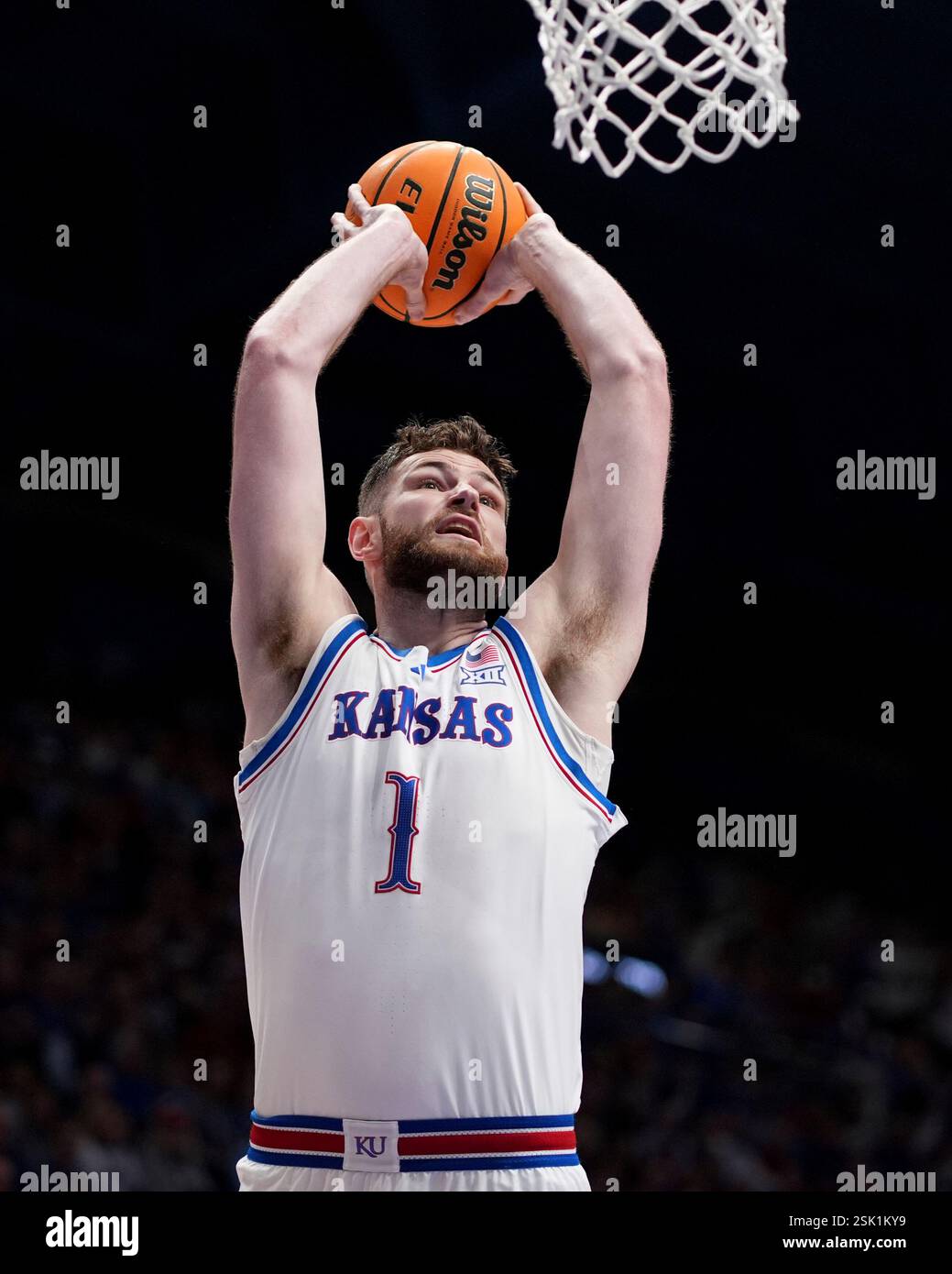Kansas center Hunter Dickinson dunks the ball during the first half of ...
