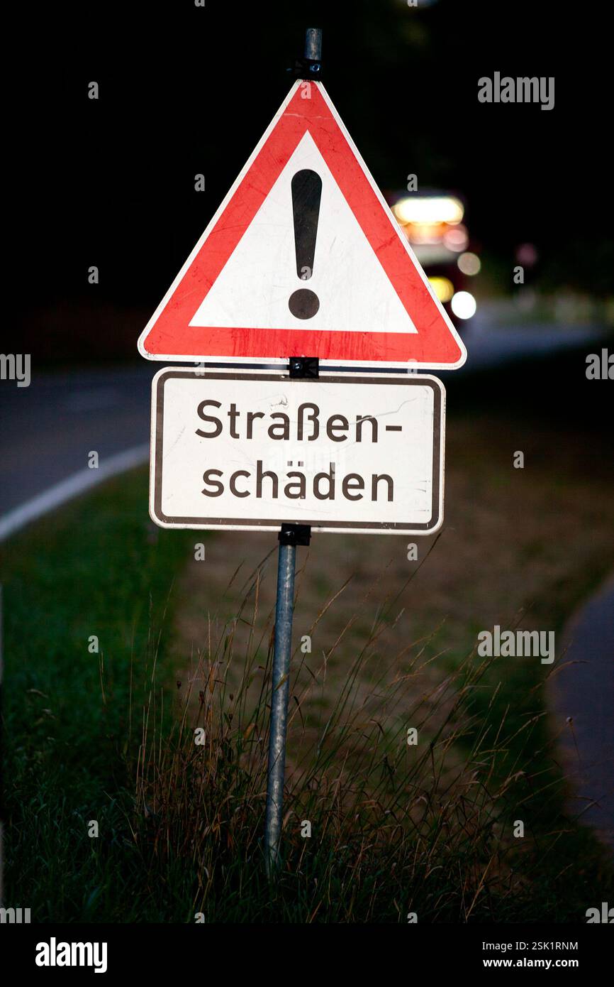 Traffic sign warning of road damage alerts drivers to danger in germany ...