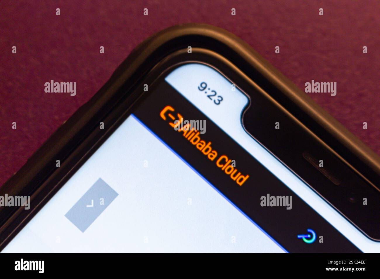 Website of Alibaba Cloud is displayed on an iPhone. Alibaba Cloud ...